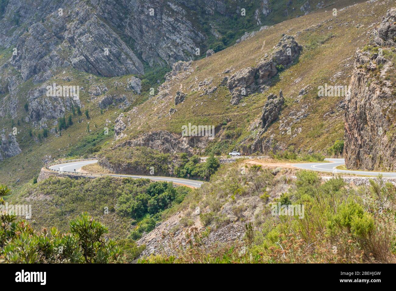 Mountain winding road background. Dramatic rocky landscape with car on ...