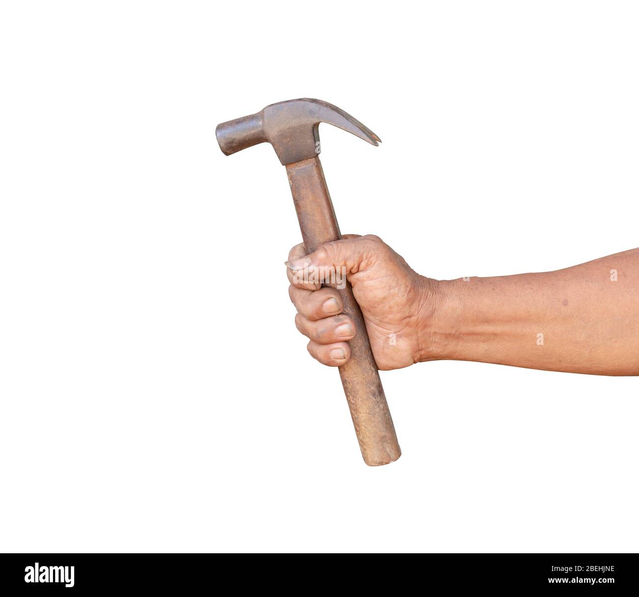 A man holding an old and rusty hammer isolated on white background with ...