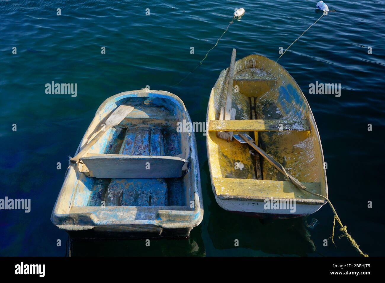 Two old rowboats along the Paseo Del Pescador along Acapulco Bay ...