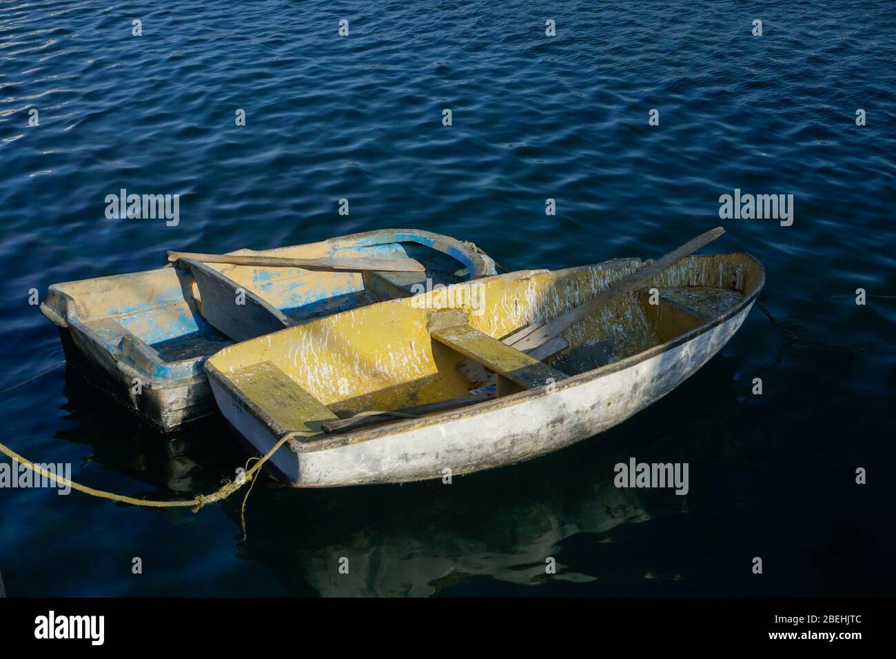 Two old rowboats along the Paseo Del Pescador along Acapulco Bay ...