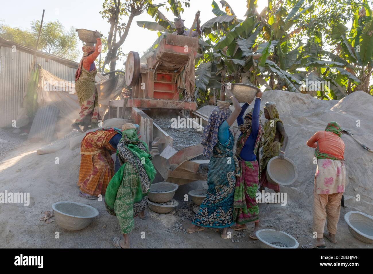 Workers Sieving Gravel Used to Produce Concrete. Their health is ...