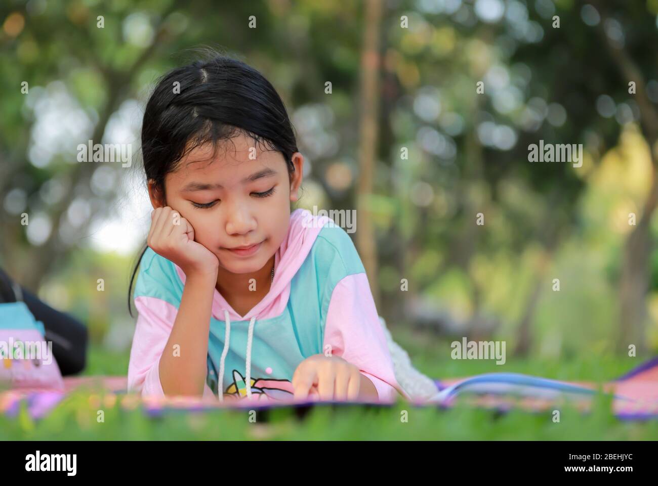 Little Girl Reading Outside