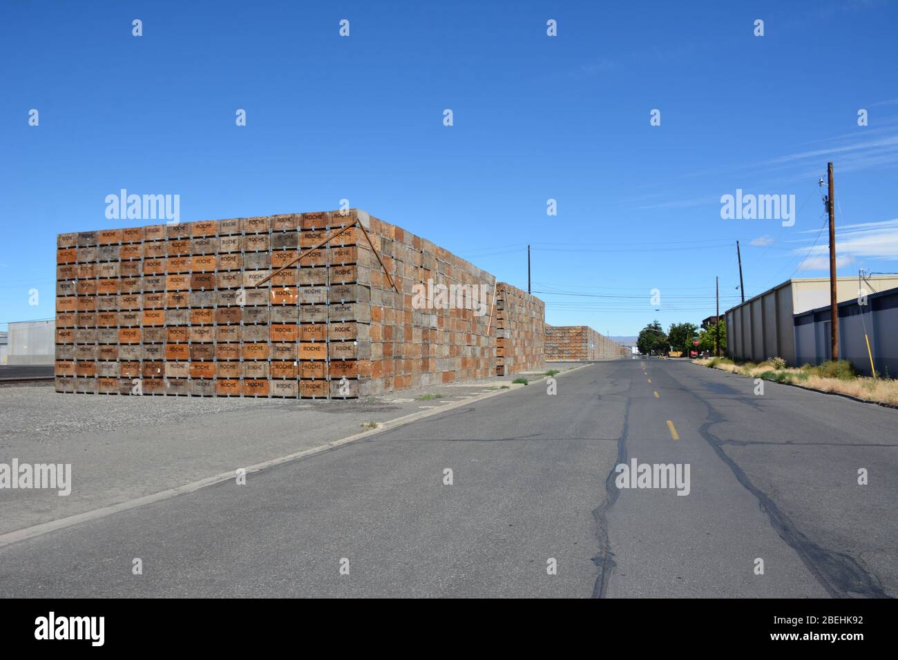 Fruit boxes / crates piled in a railroad yard in Yakima, Washington ...