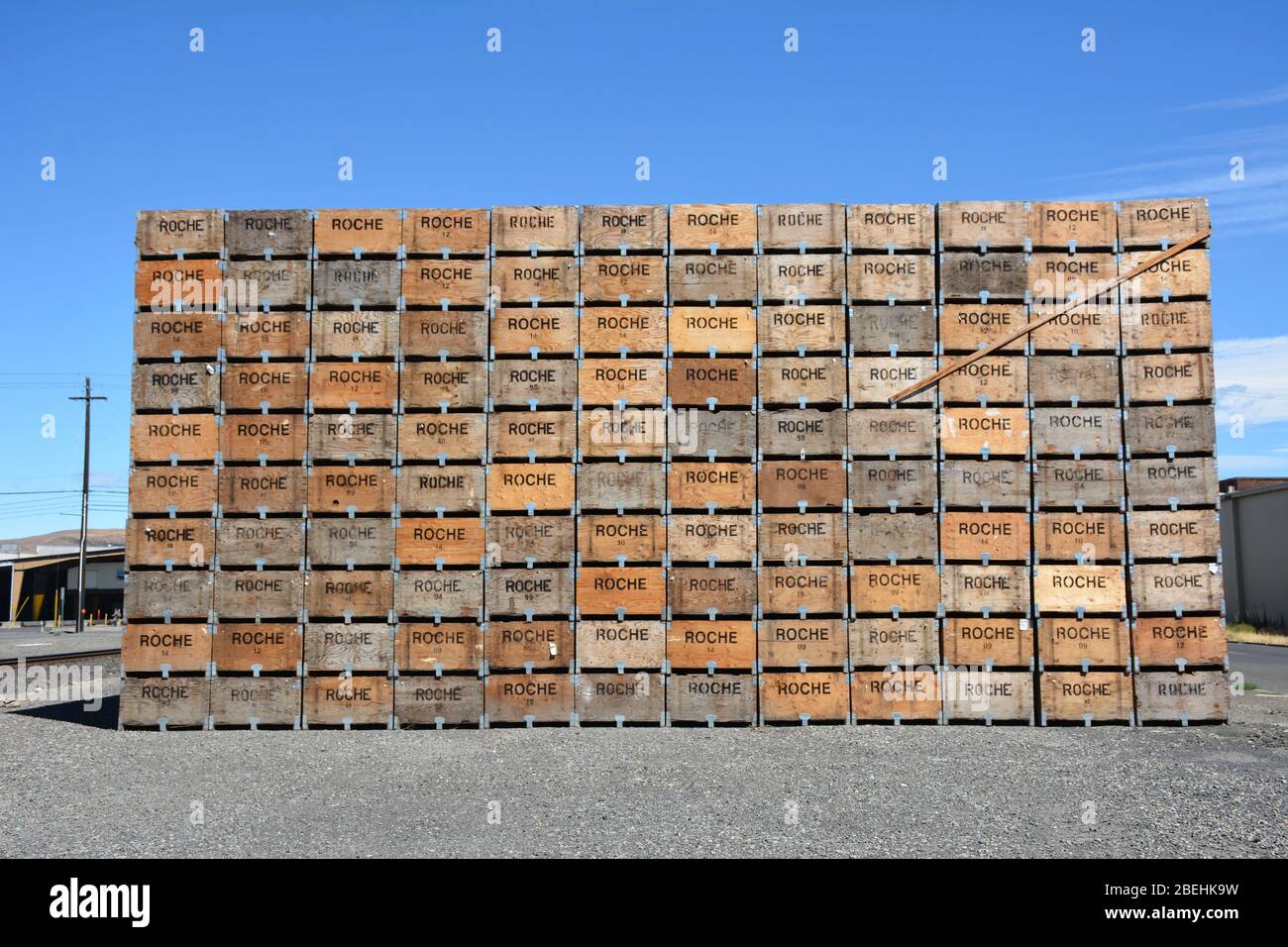 Fruit boxes / crates piled in a railroad yard in Yakima, Washington ...