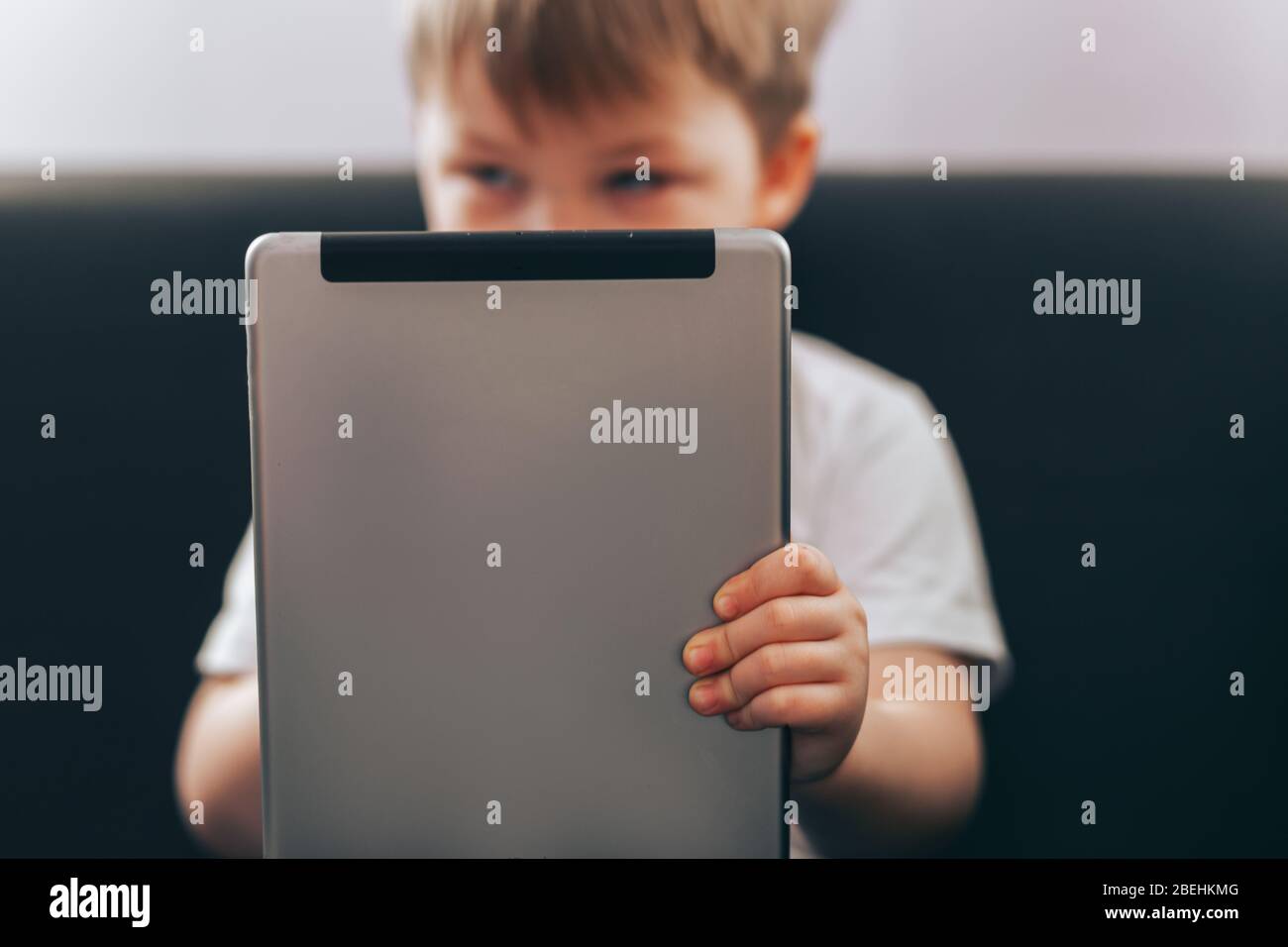 Little boy with a tablet Stock Photo - Alamy
