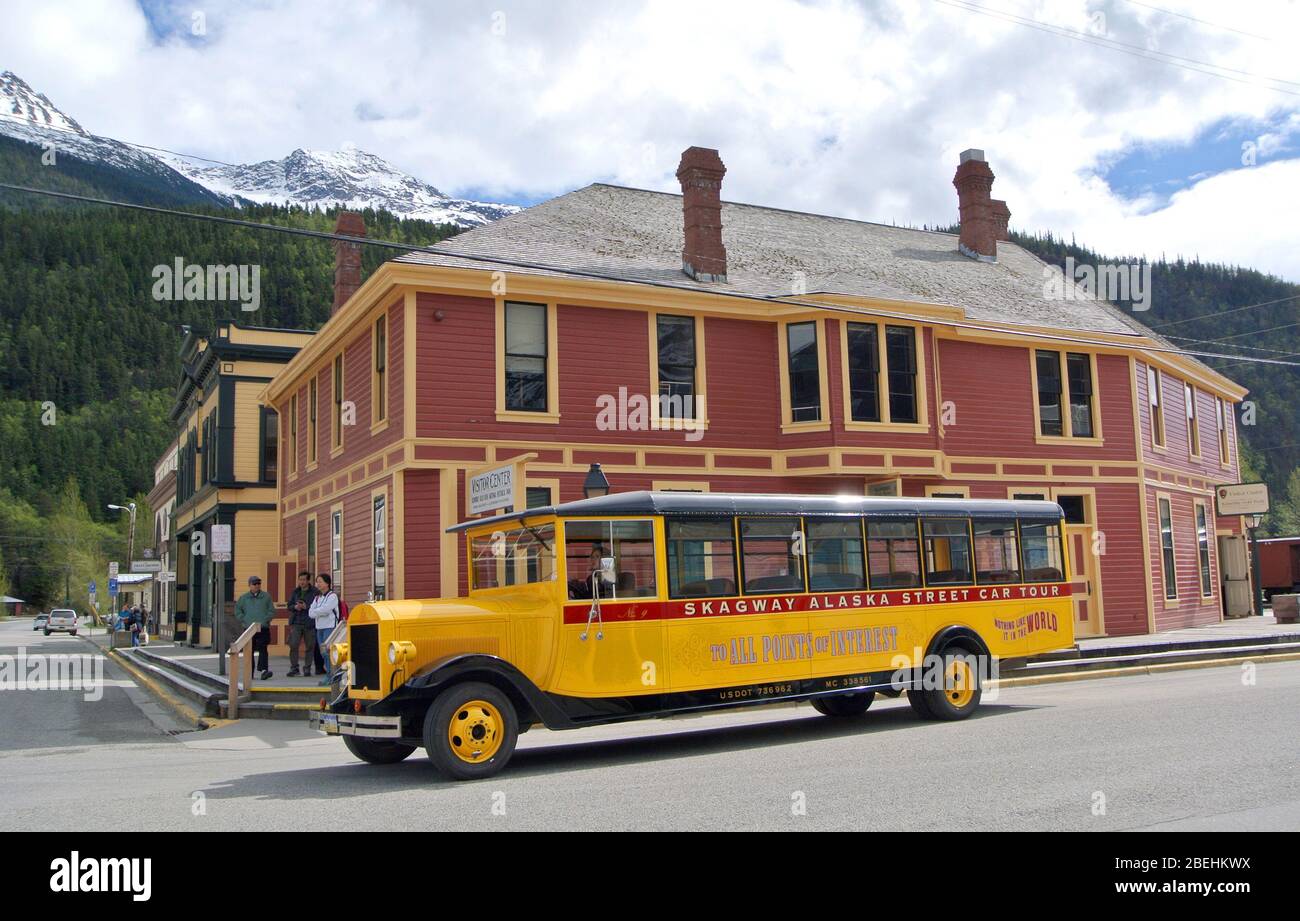 classic tourisit bus shuttles tourists in Skagway Alaska Stock Photo ...