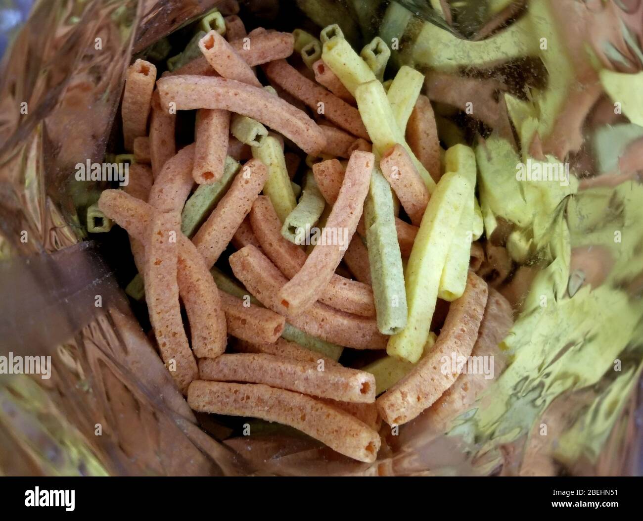 Vegetable straw chips inside the snack bag Stock Photo - Alamy