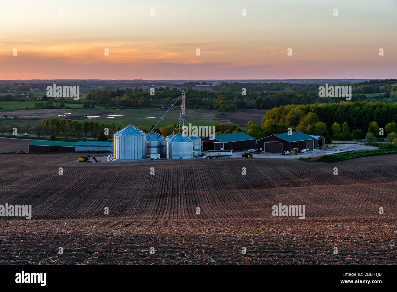 Farm field with silo Stock Photo - Alamy