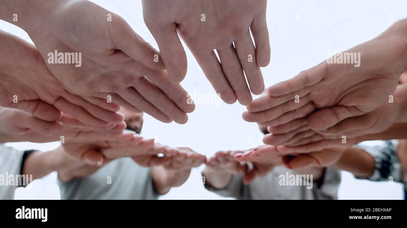 bottom view. circle of hands Stock Photo - Alamy