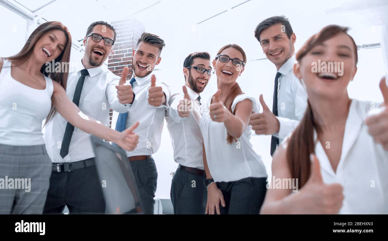 successful business team showing the thumb up Stock Photo - Alamy