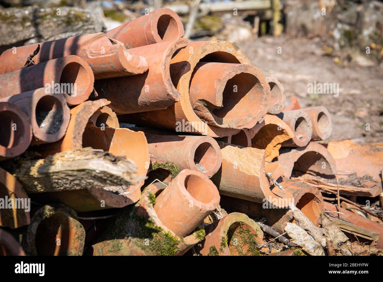 Clay water pipes. Polluted environment, waste and surroundings cleaning ...