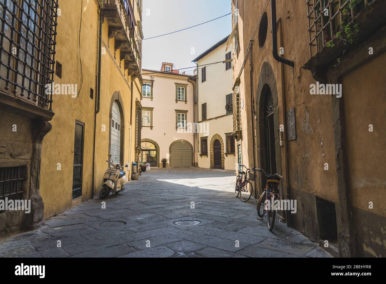 Narrow streets of Lucca ancient town with traditional architecture ...