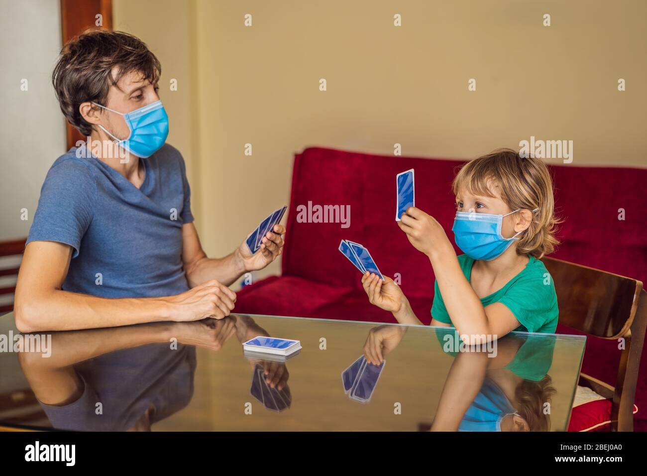 Happy Family Playing Board Game At Home. Stay at home due to quarantine ...