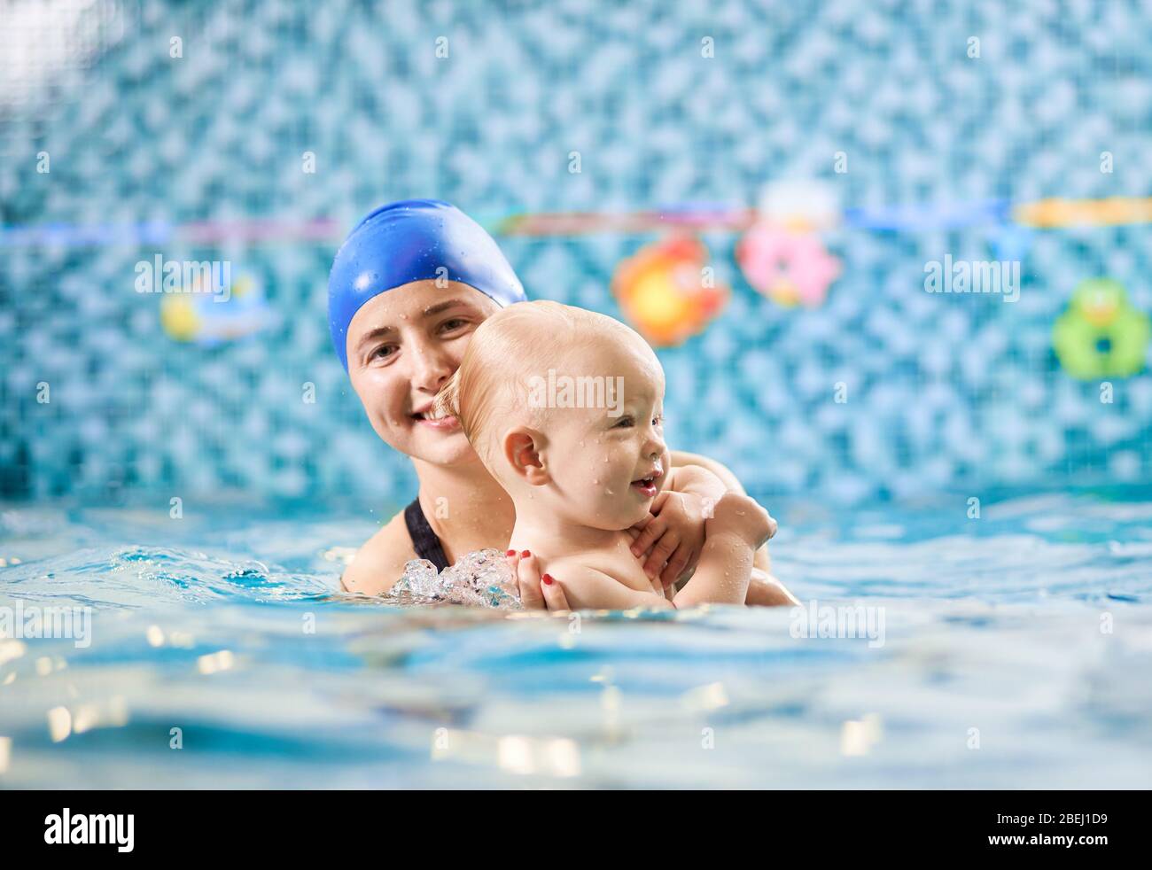 Baby in swimming pool hi-res stock photography and images - Alamy