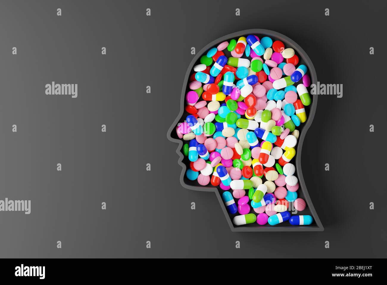 Human head filled with multicolor pills and capsules over dark ...