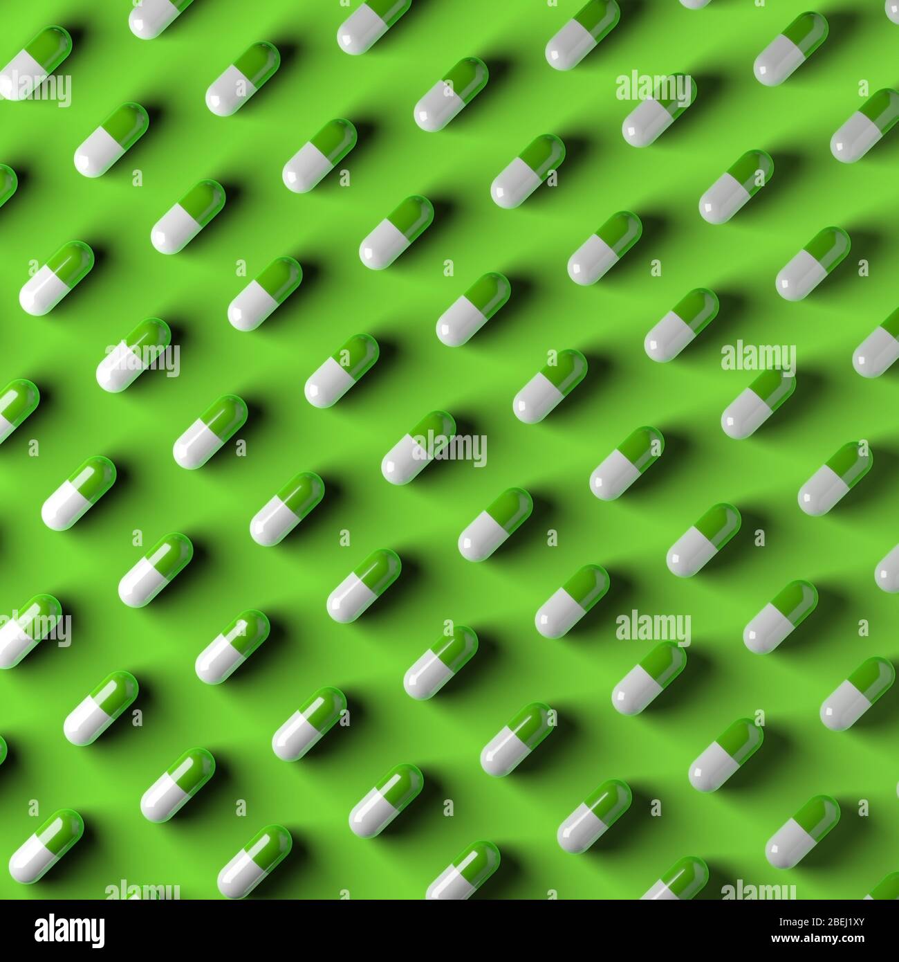 Green and white pill capsules layed out geometrical on green background ...