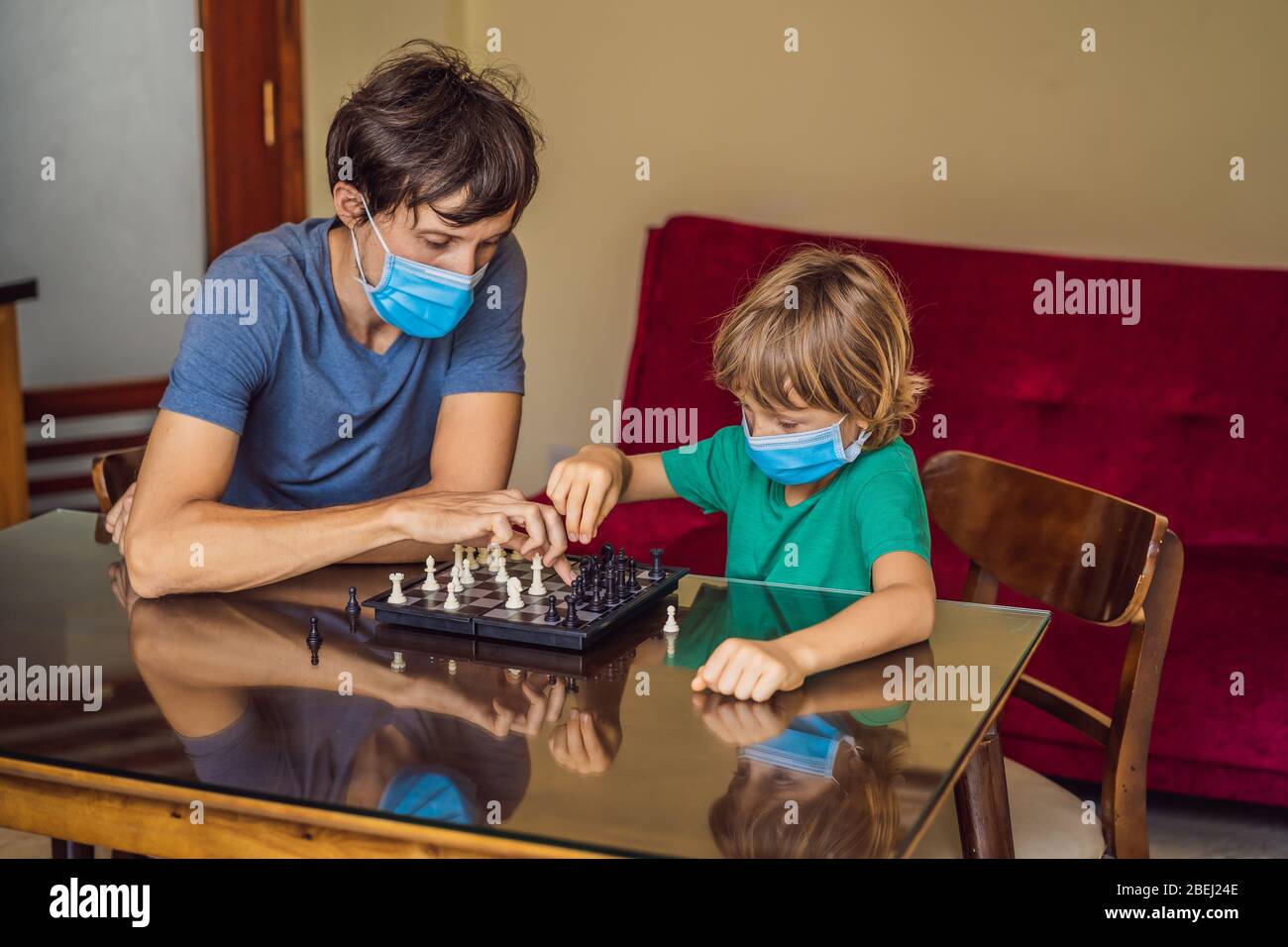 Happy Family Playing Board Game At Home. Stay at home due to quarantine ...
