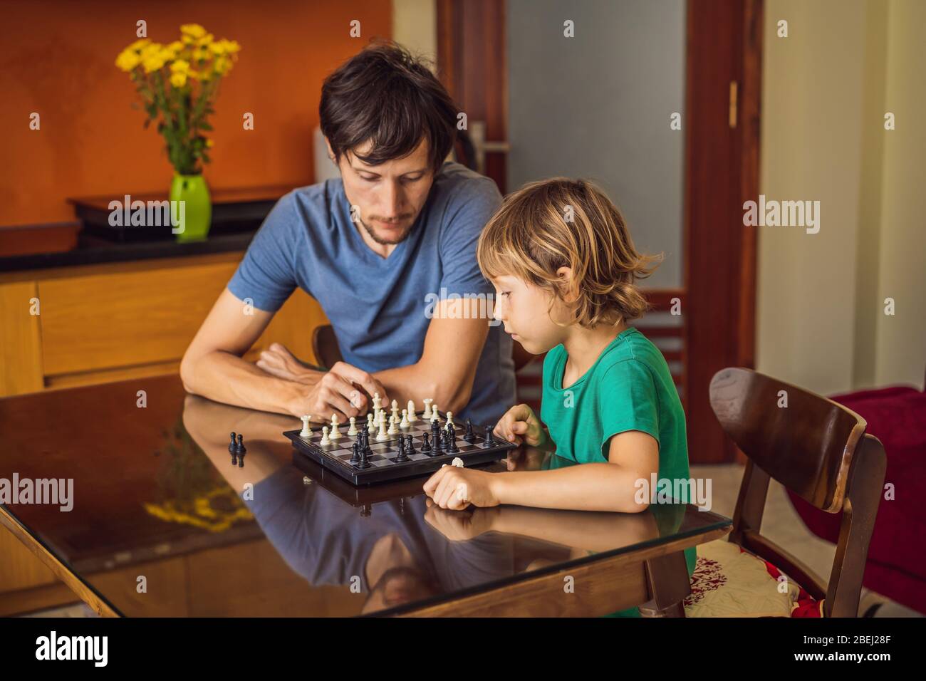 Happy Family Playing Board Game At Home Stock Photo - Alamy