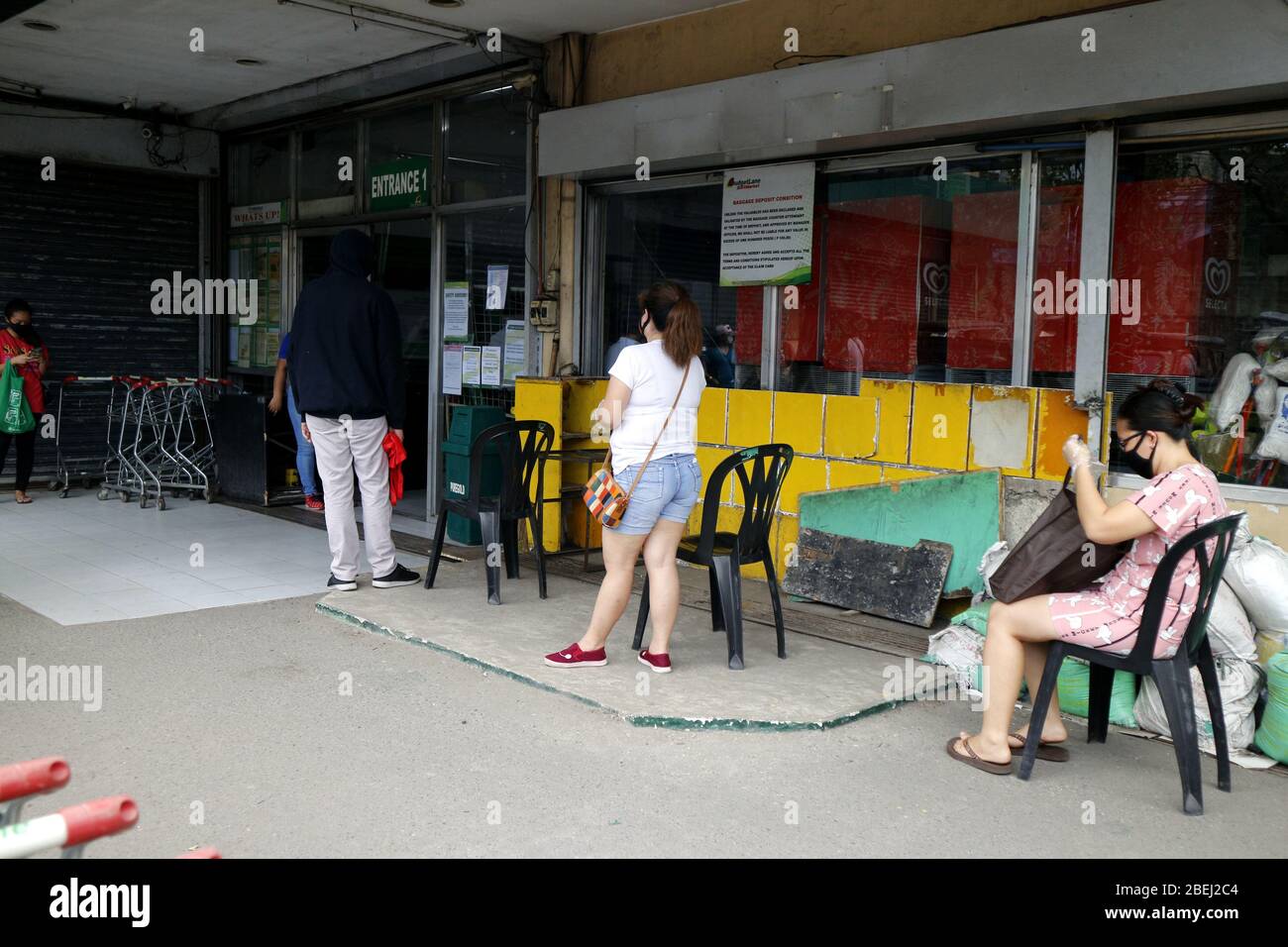 Antipolo City, Philippines - April 13, 2020: Customers line up outside ...