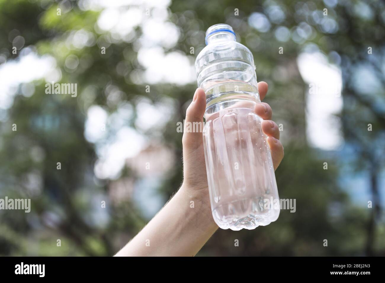 Hand holding water bottle hi-res stock photography and images - Alamy