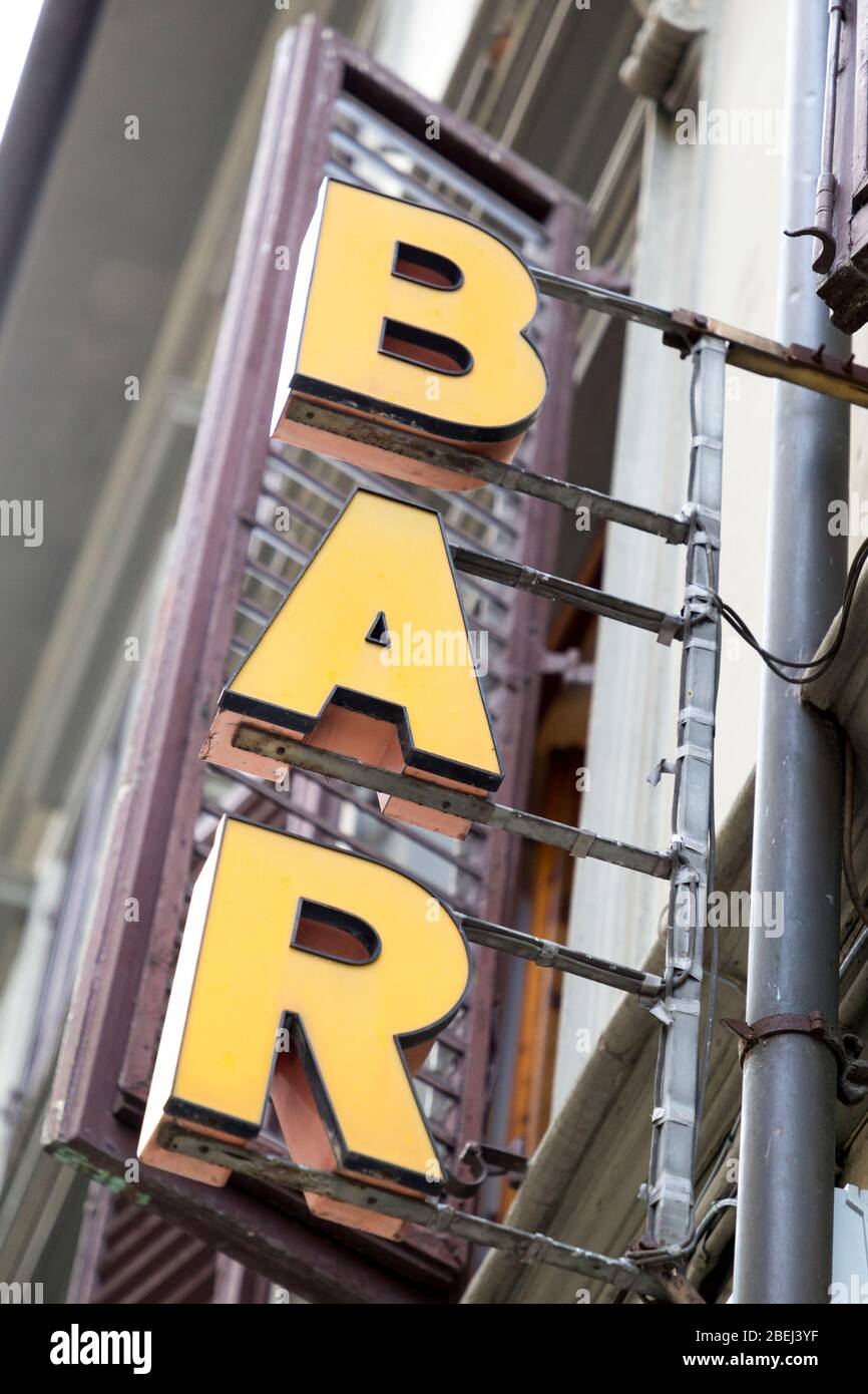 A yellow BAR sign seen in Florence, Italy Stock Photo - Alamy