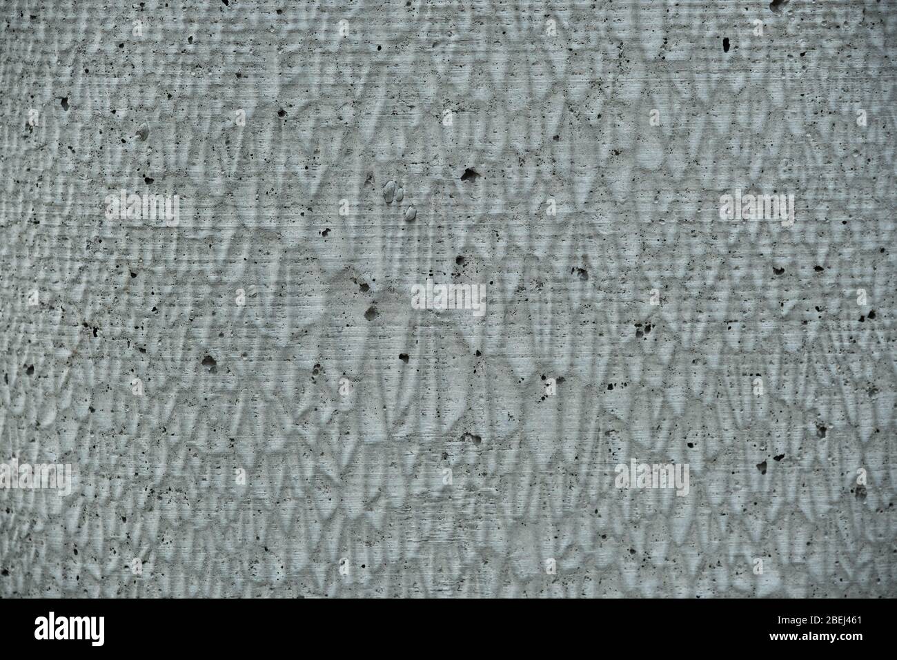 Concrete background with jagged pattern and blurry edges. Gray concrete ...