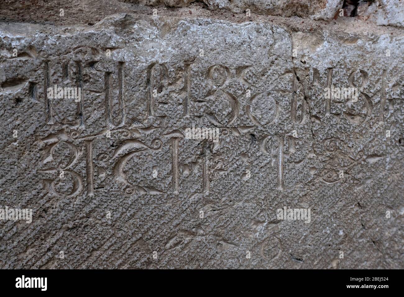 An old carved script in the Armenian language carved in the outer wall ...
