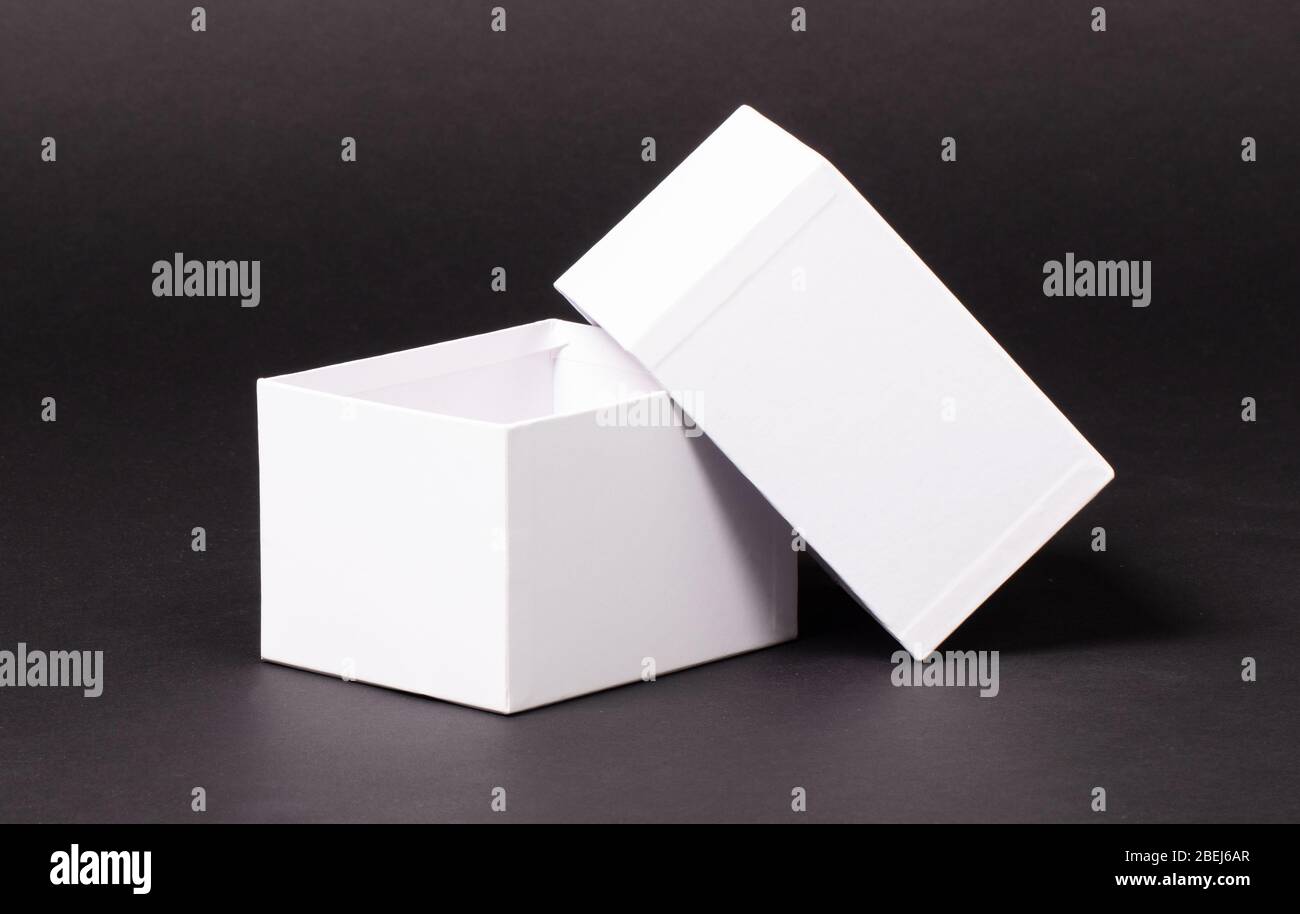 Opened blank White box isolated on a black background Stock Photo - Alamy