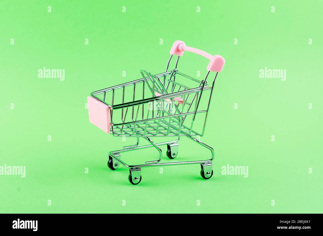Small supermarket grocery push toy cart for shopping Stock Photo - Alamy