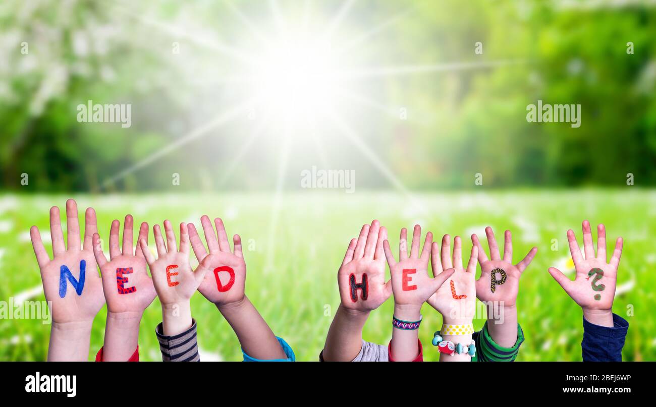 Children Hands Building Word Need Help, Grass Meadow Stock Photo - Alamy