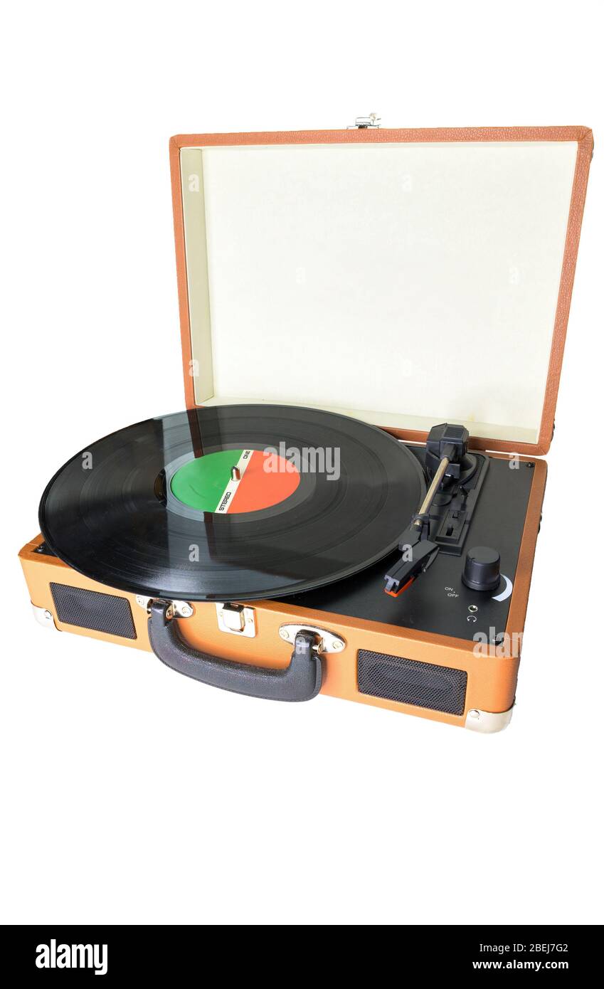 Old-fashioned suitcase record player and turntable with a vinyl record ...