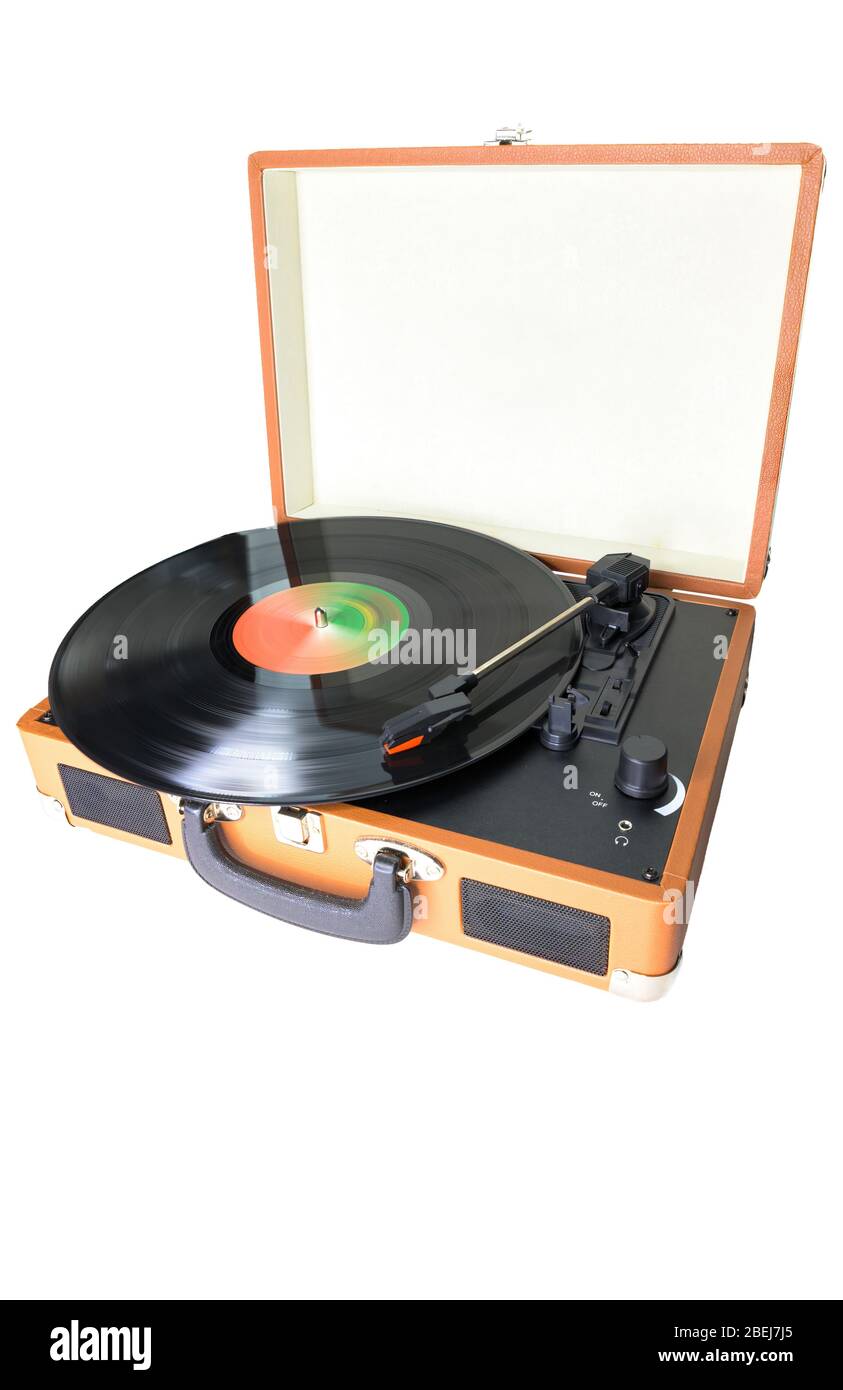 Old-fashioned suitcase record player and turntable with a spinning ...