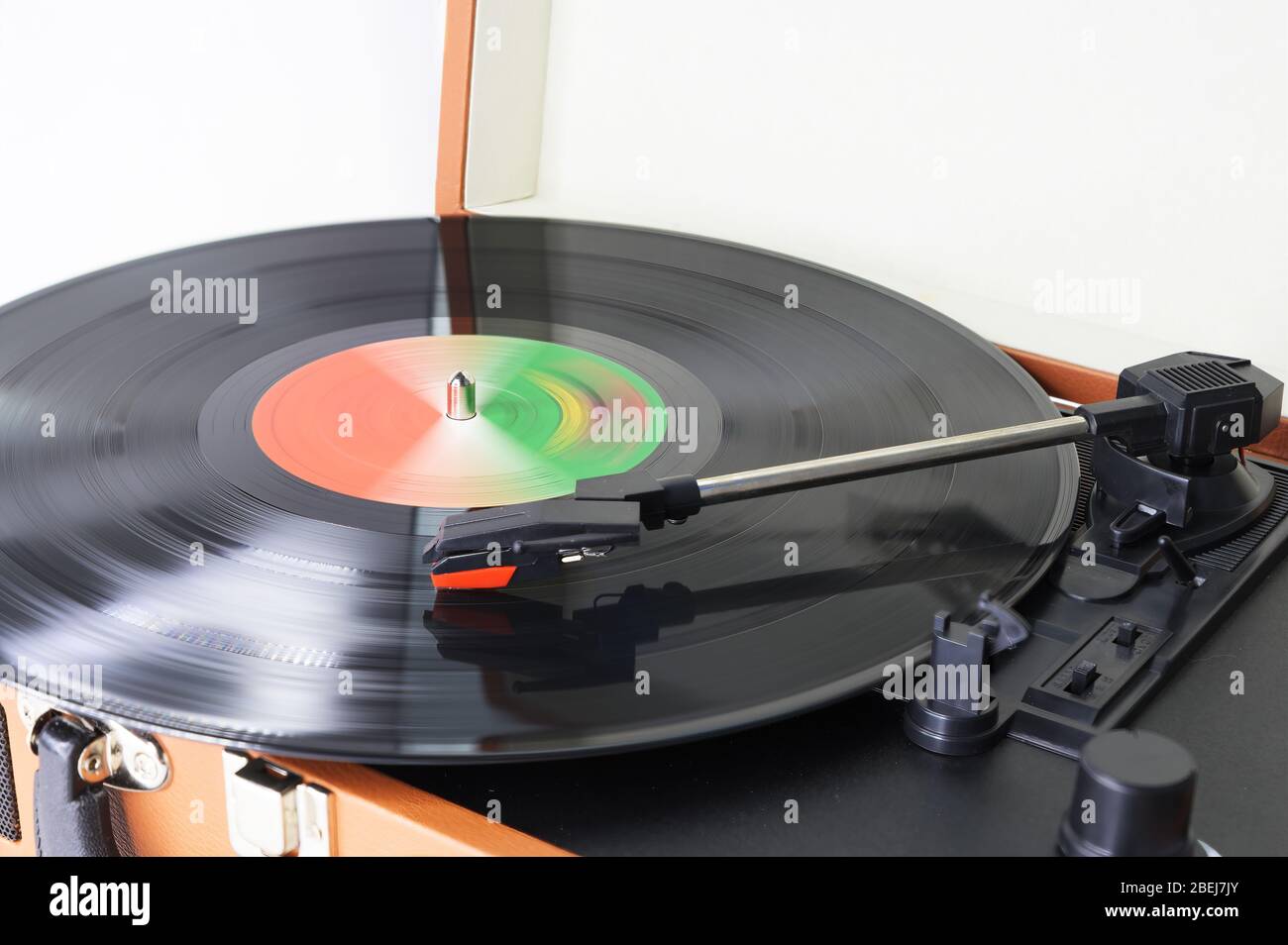 Close-up of an old-fashioned suitcase record player and turntable with ...