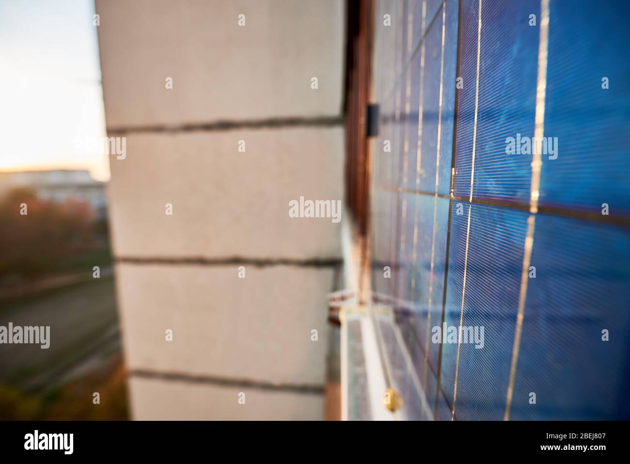 Close up of solar panel on window of a high-rise residential building ...