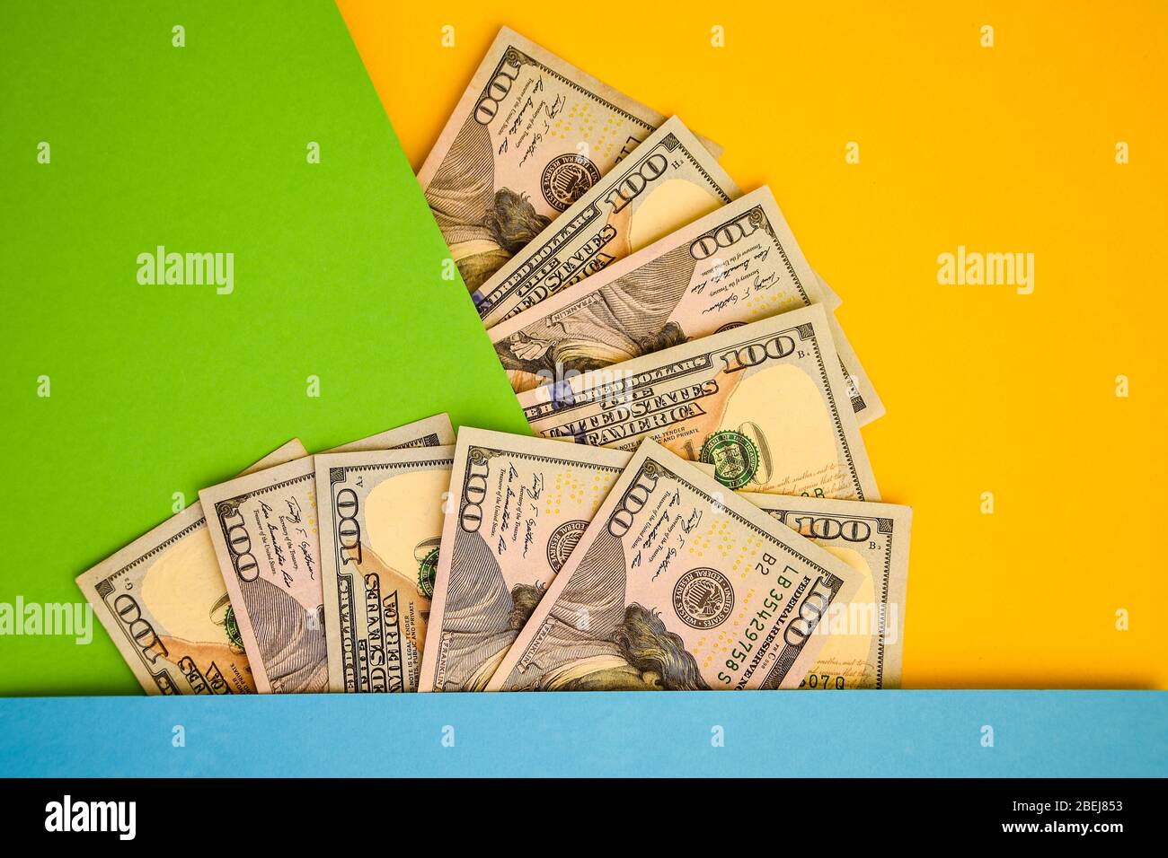 Cash Money on colorful background, Fan of 100 dollar bills on color ...