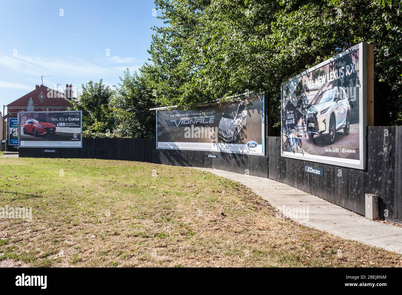 Billboards advertising signs display competing car brands, makes and ...