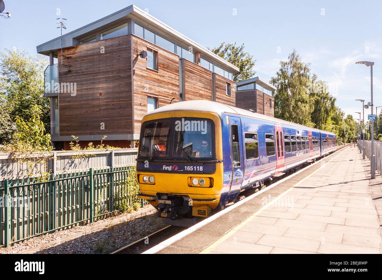 First GWR train pulls in at station past residential apartments and ...