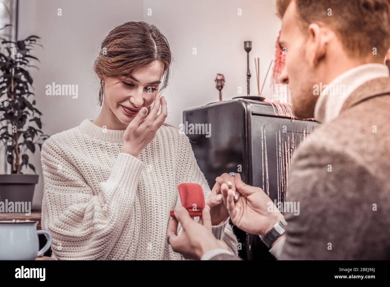 Surprised engaged woman shedding happy tears after being proposed on a ...
