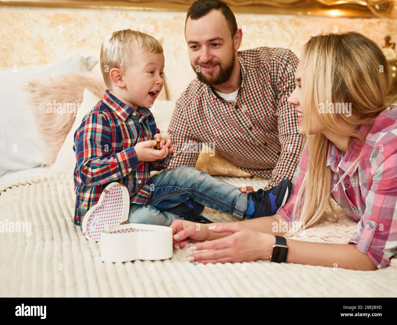 happy laughing little boy with parents, smiling kid, happy family ...