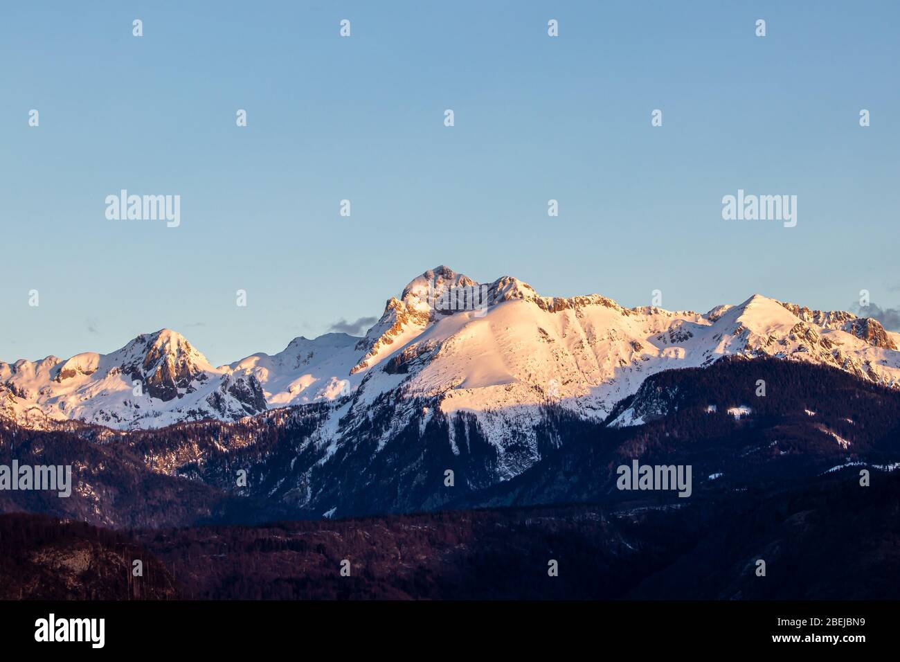 Triglav mountain range covered in morning light Stock Photo - Alamy