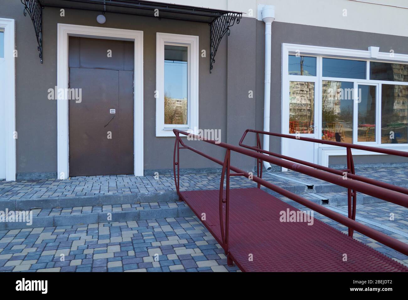 Wheelchair access ramp for entrance of residential multistory building ...