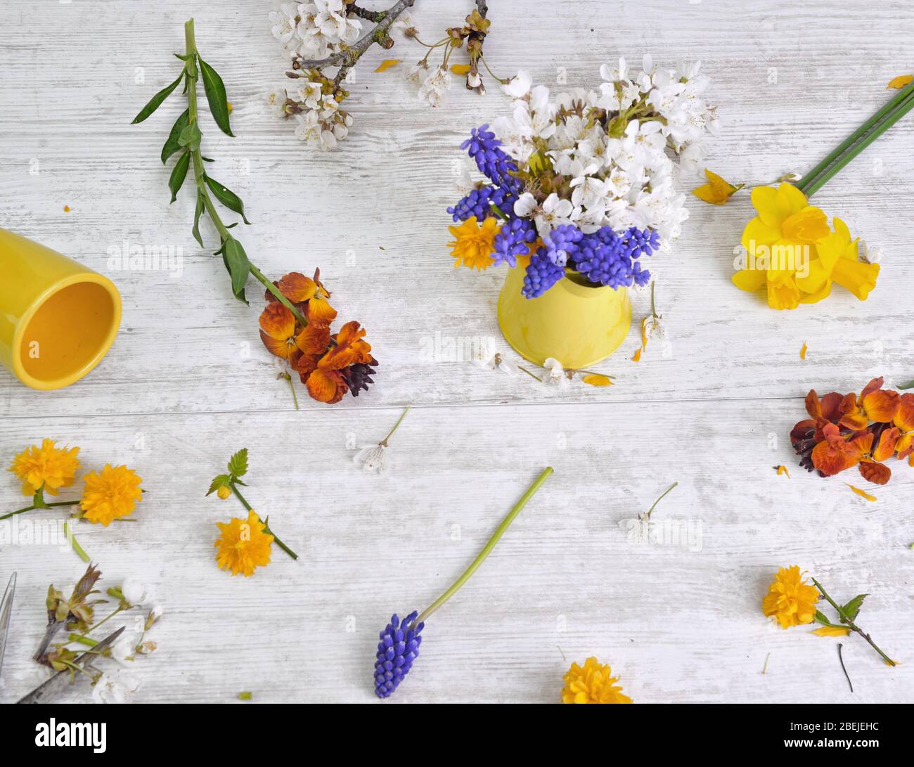 garden flowers picked and scattered on a table to make a bouquet at ...
