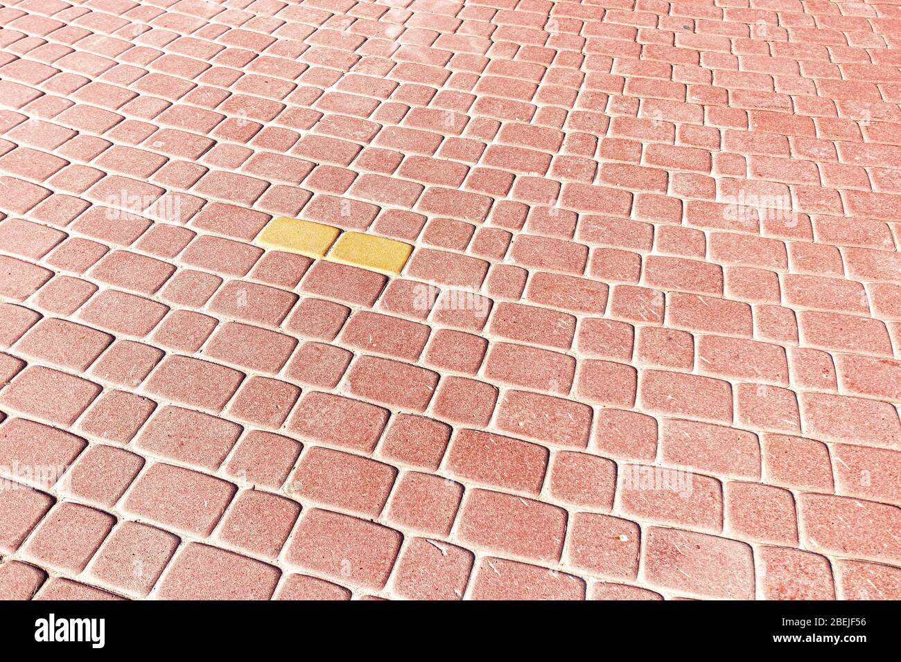 Top view on red paving stone road. Old pavement of granite texture ...