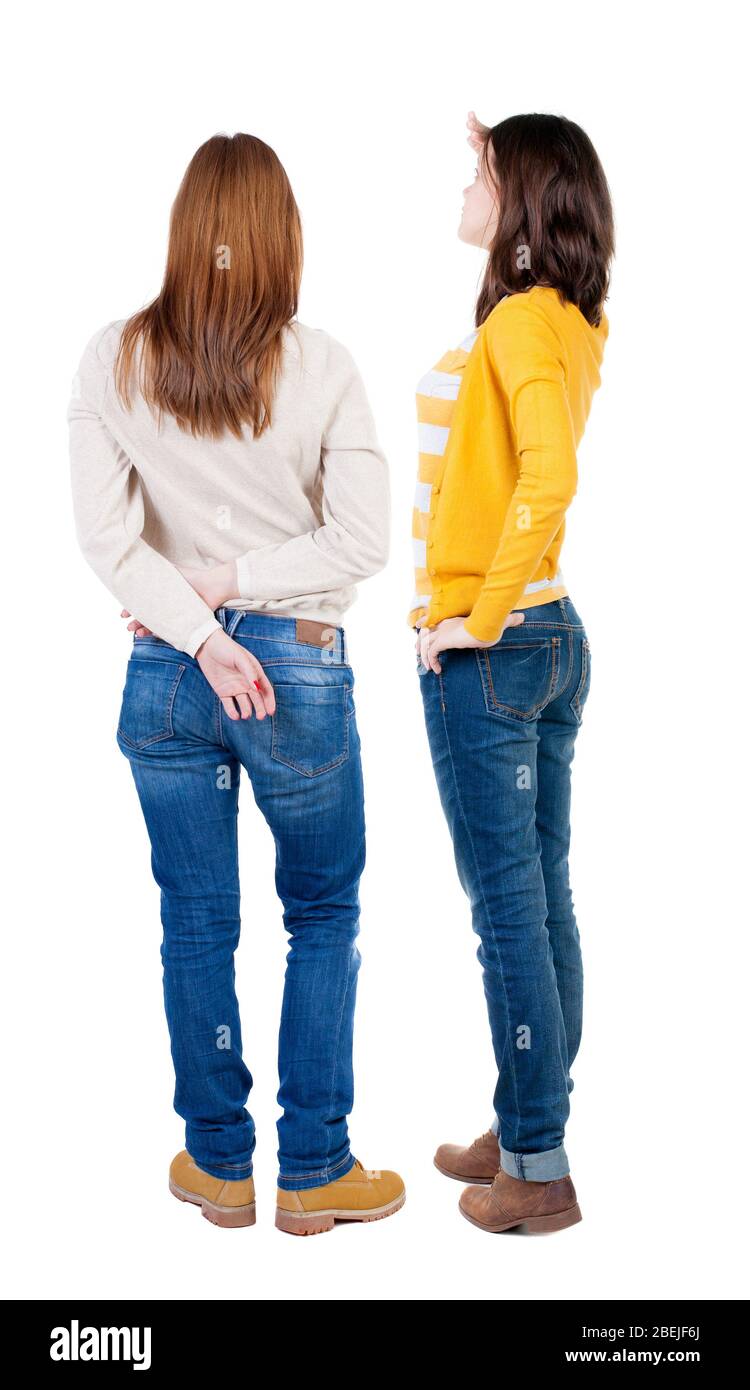 Back view of two woman in sweater. Rear view people collection ...