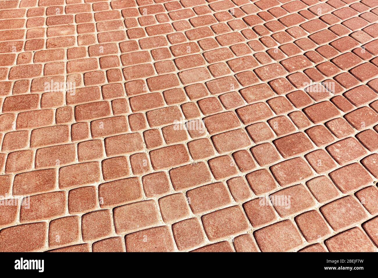 Top view on red paving stone road. Old pavement of granite texture ...