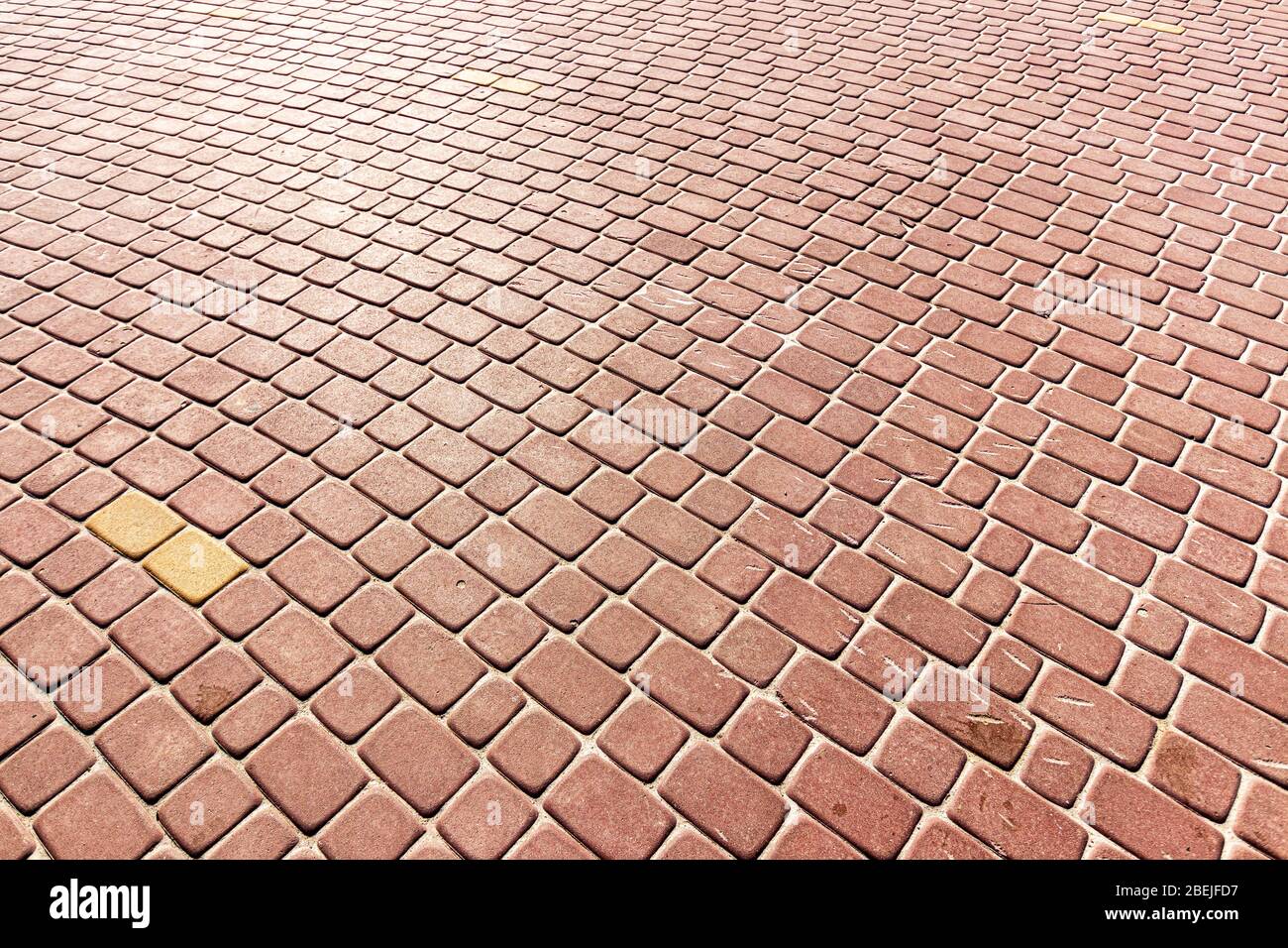 Top view on red paving stone road. Old pavement of granite texture ...