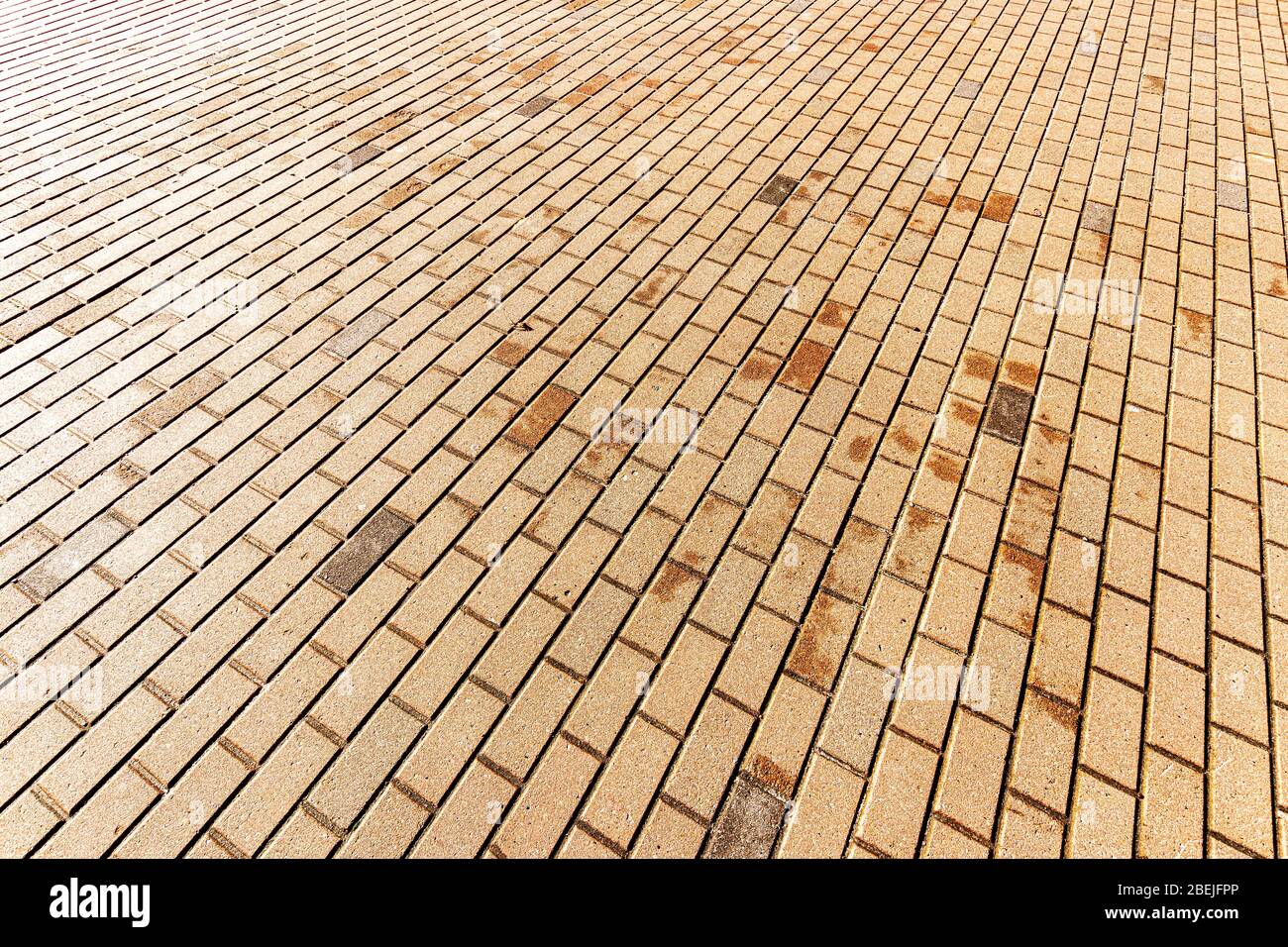 Top view on orange paving stone road. Old pavement of granite texture ...