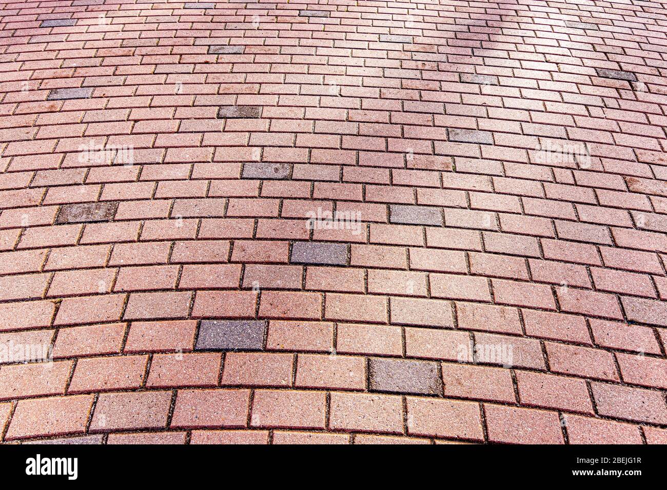 Top view on red paving stone road. Old pavement of granite texture ...