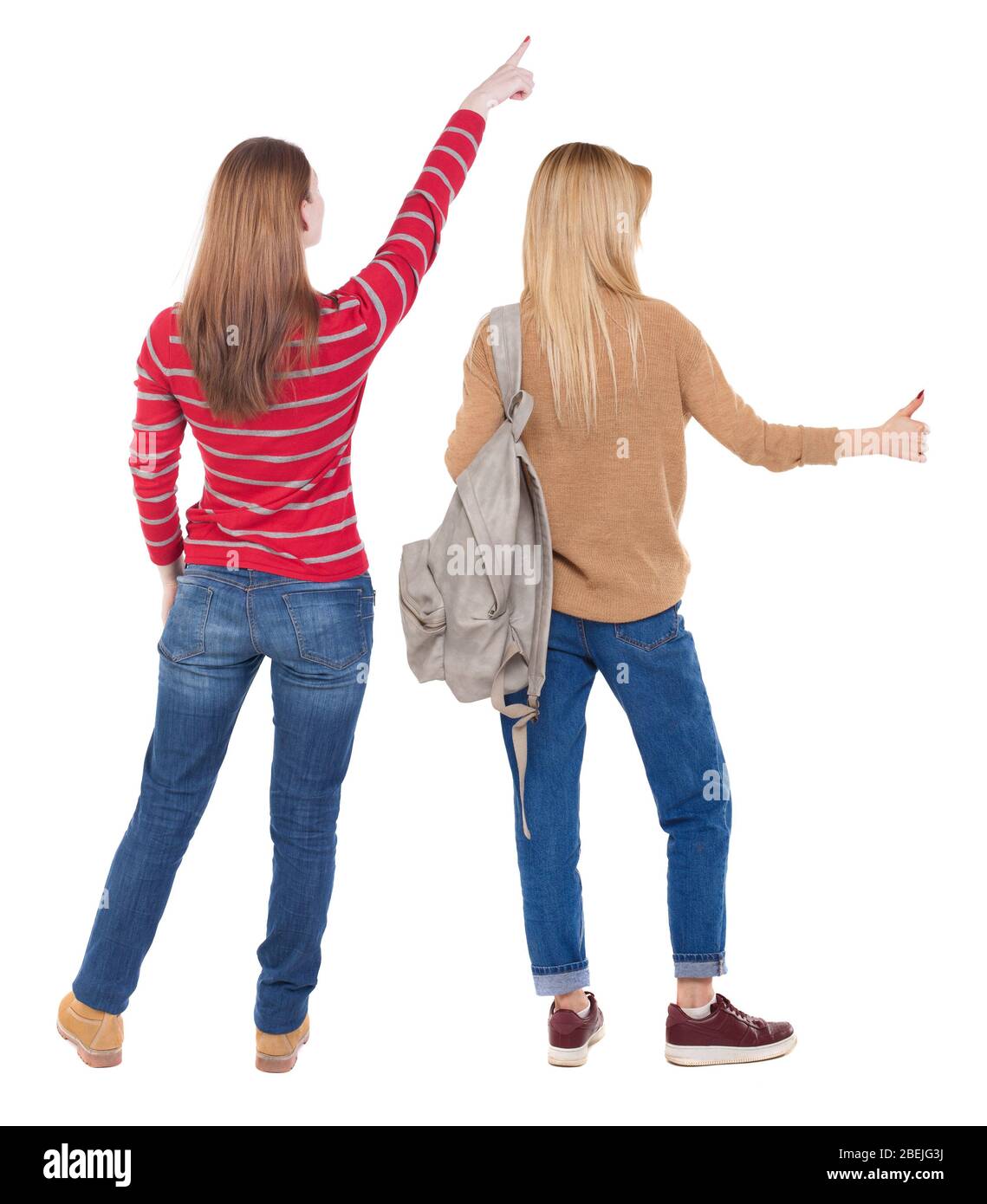 Back view of two pointing girl in sweater. Rear view people collection ...