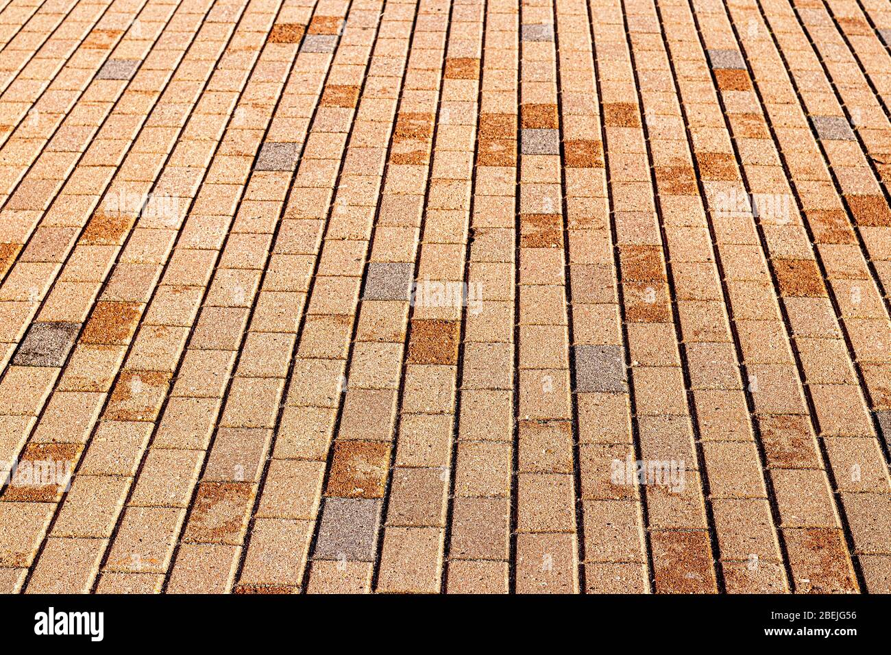 Top view on orange paving stone road. Old pavement of granite texture ...